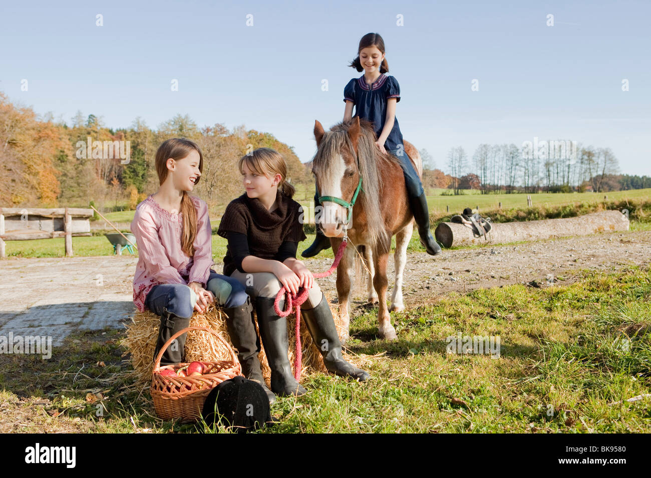 Girls at a stable Stock Photo - Alamy
