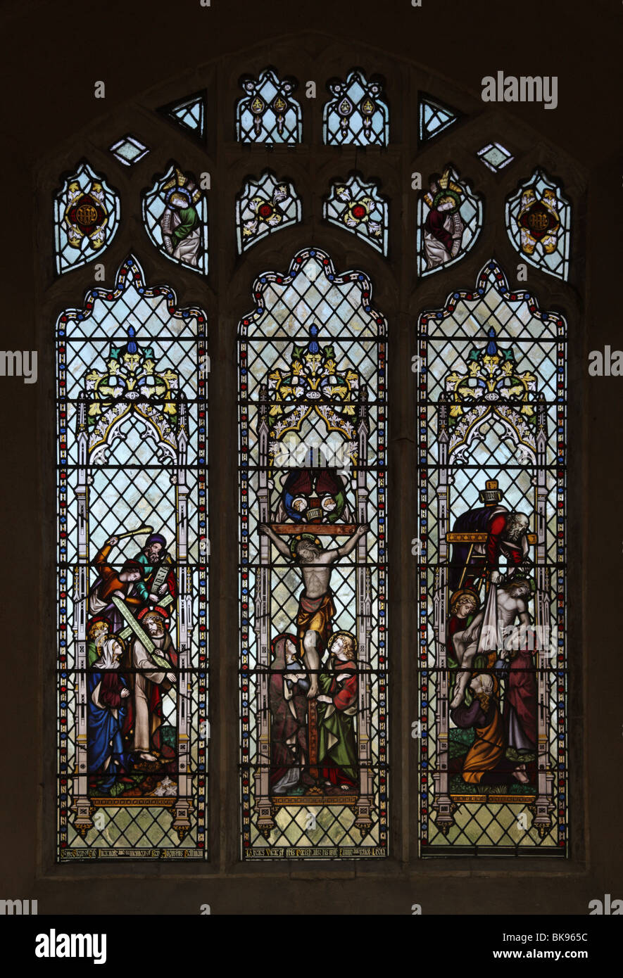 A stained glass window depicting the Crucifixon and Scenes from the ...