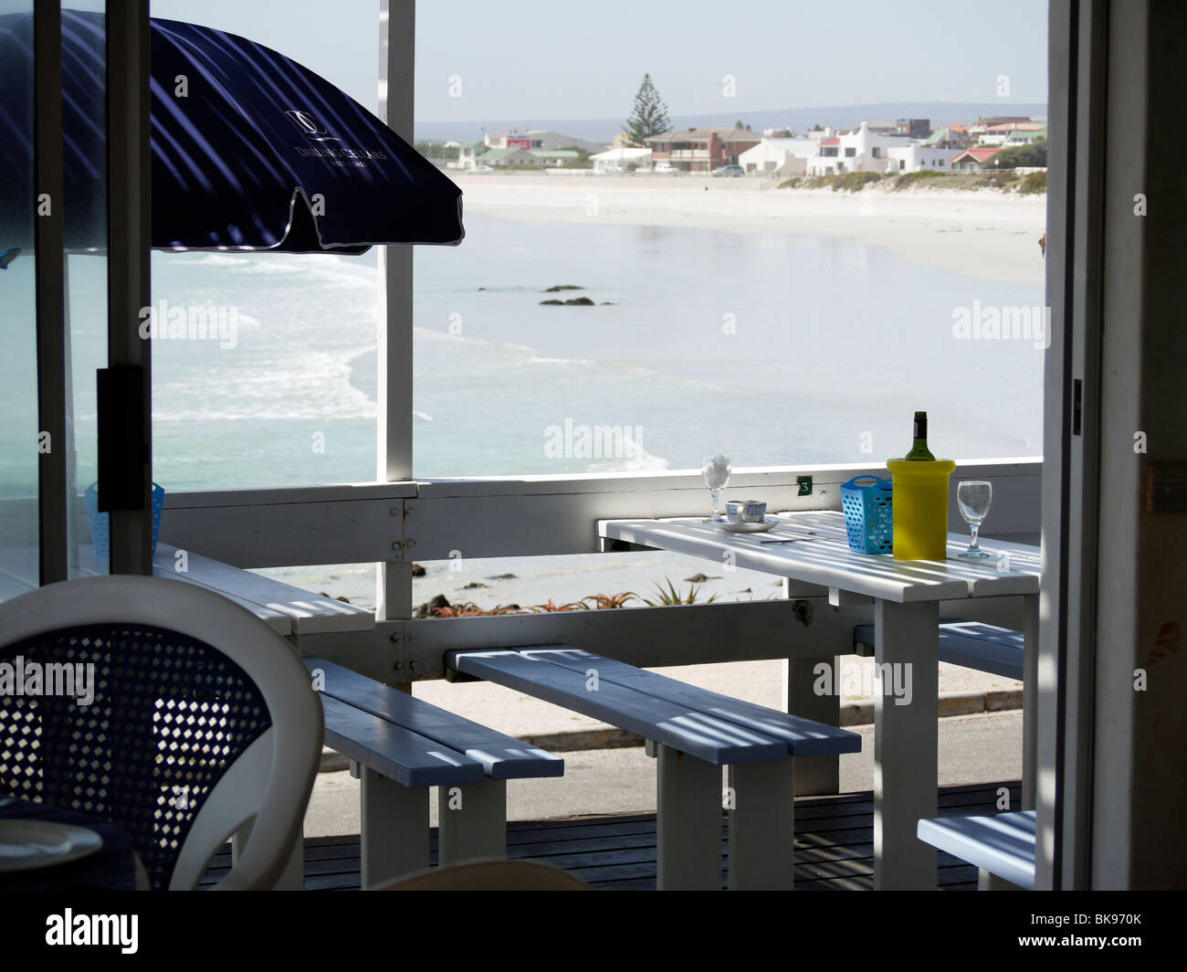 Cafe bar restaurant table with a backdrop of a seaside resort ...