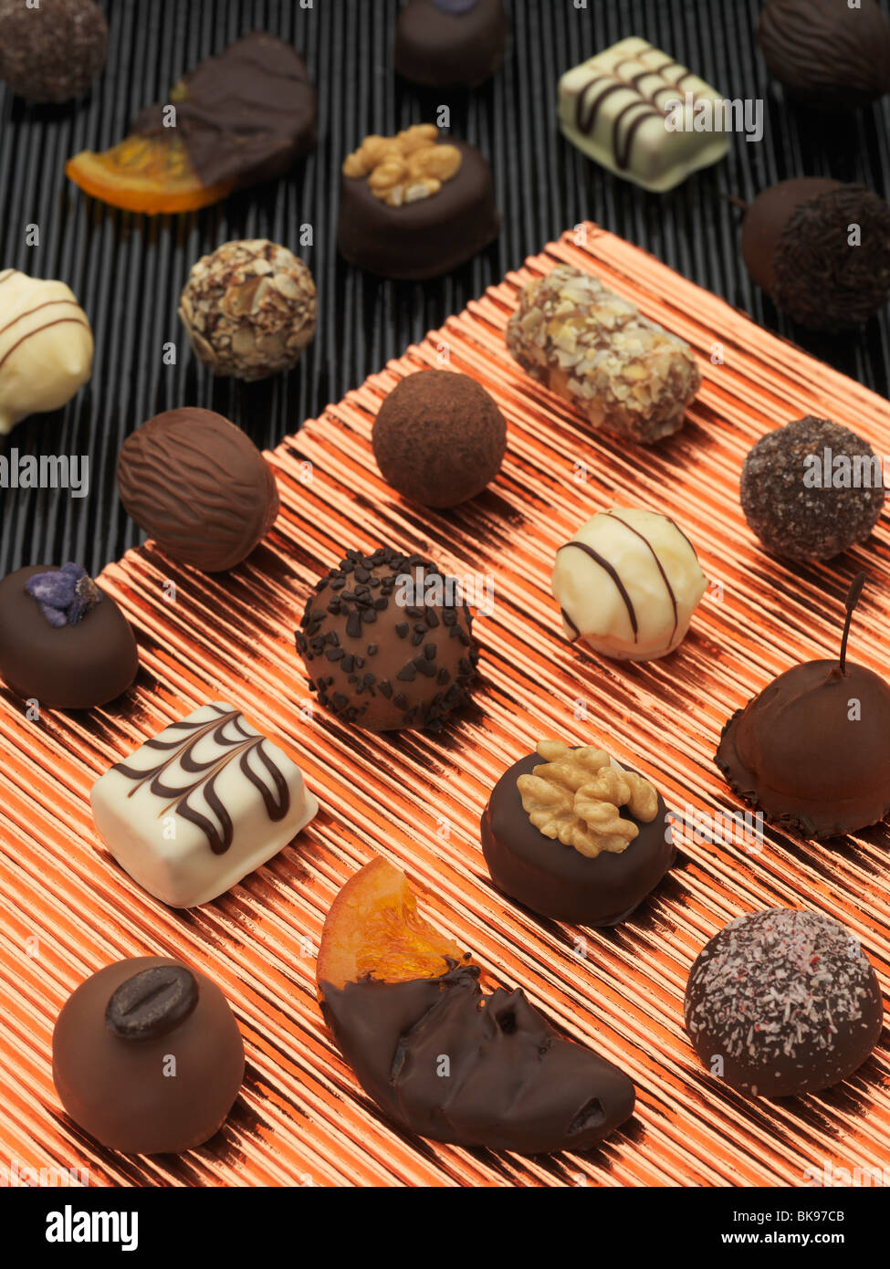 A tray of mixed chocolates milk,dark and white Stock Photo - Alamy