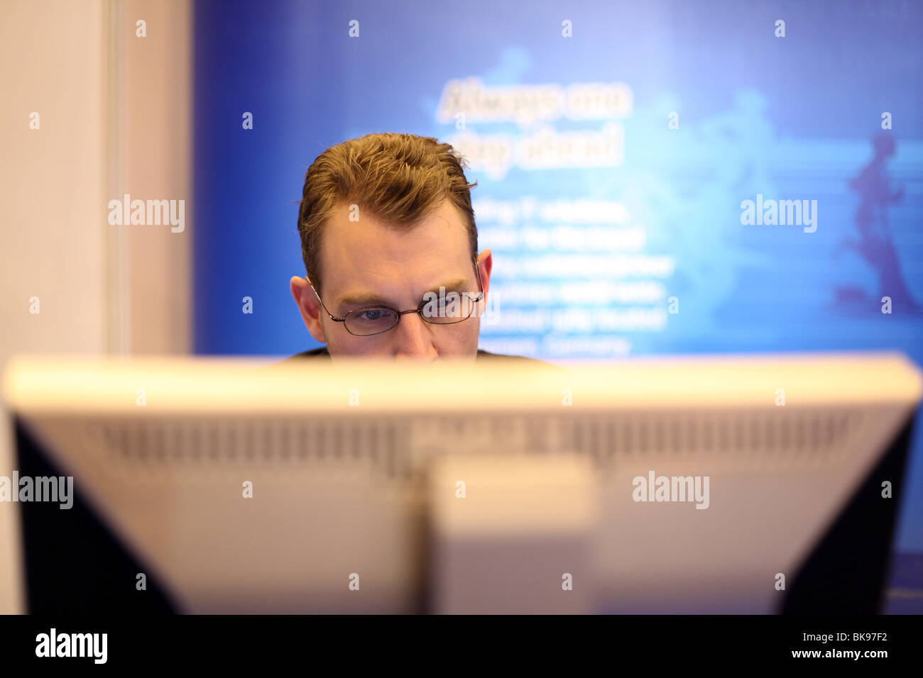 A man working on a computer Stock Photo - Alamy