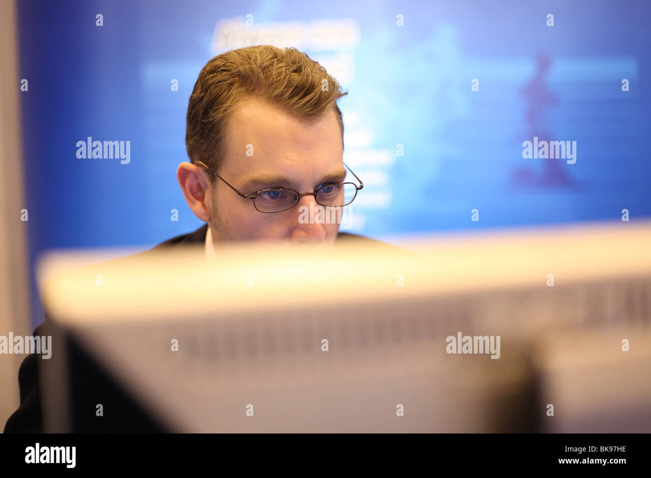 A man working on a computer Stock Photo - Alamy