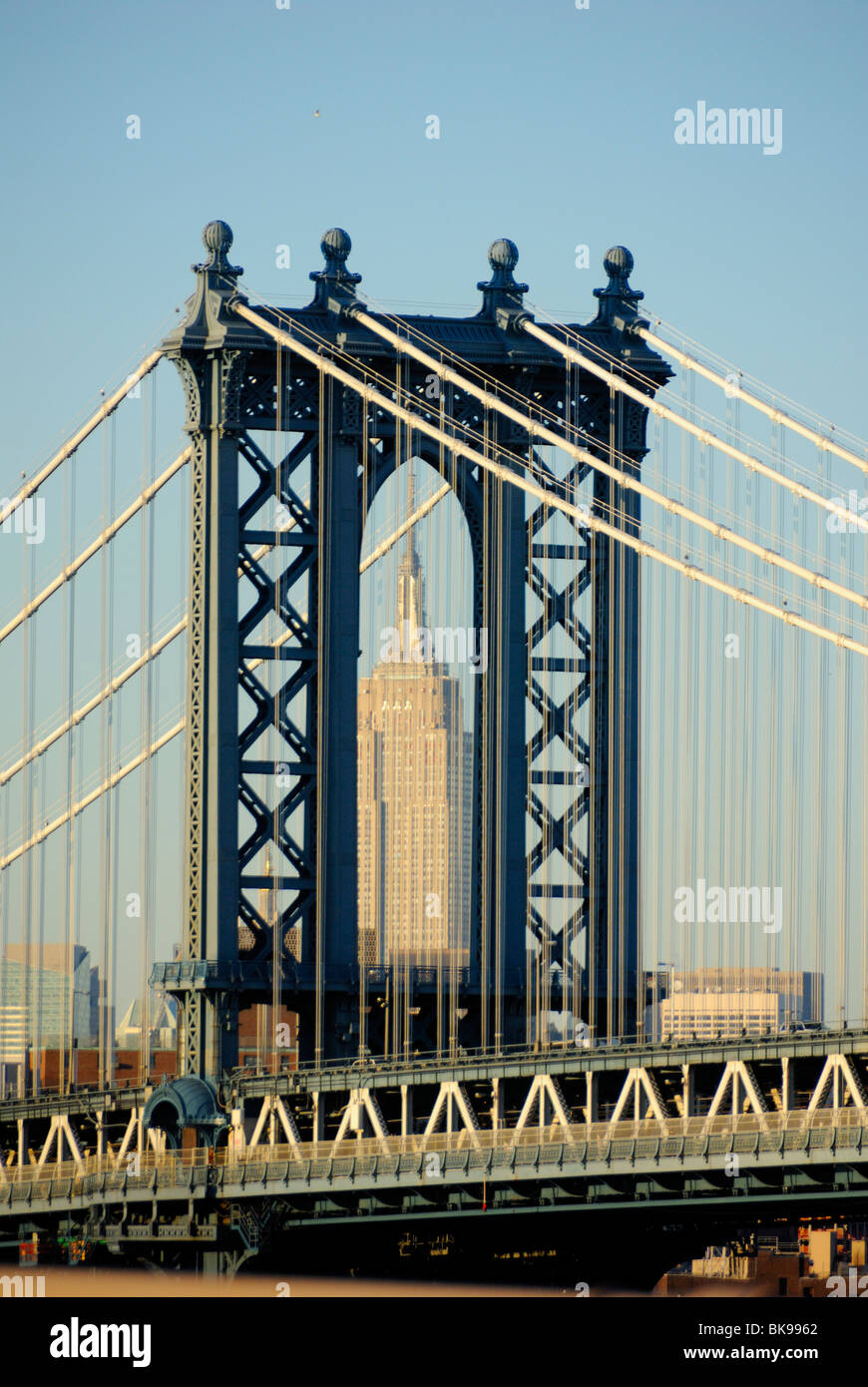 Skyscraper viewed through a bridge, Manhattan Bridge, Empire State ...
