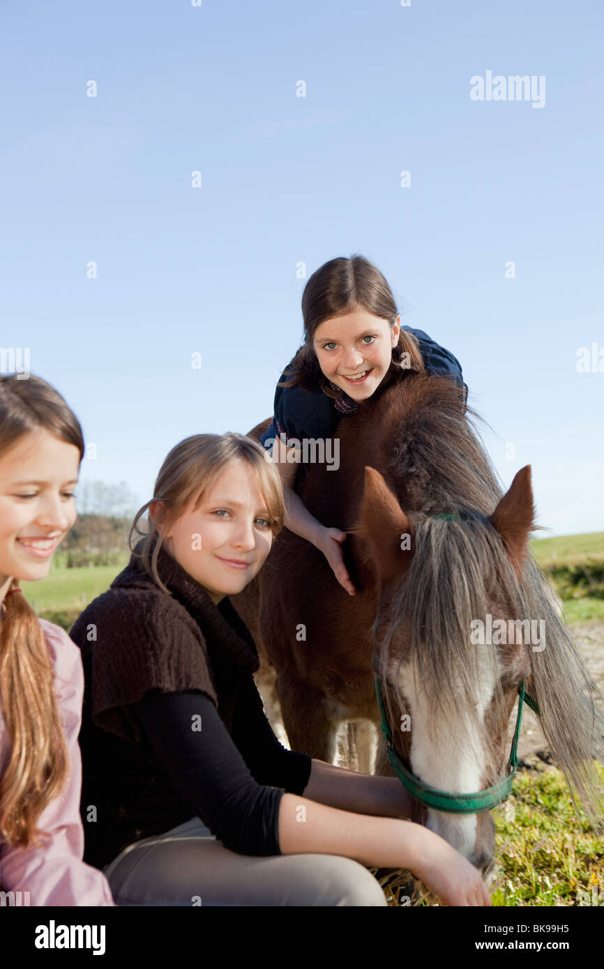 Friends with horse Stock Photo - Alamy