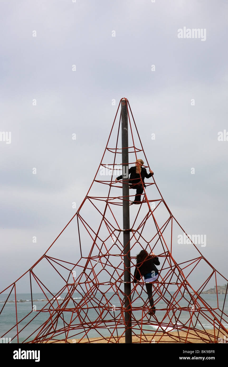 Two gilrs playing on Rope Stock Photo - Alamy