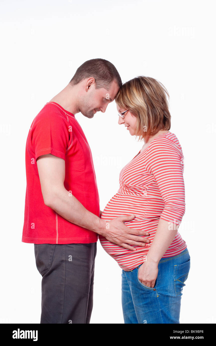 happy expecting couple holding each other - isolated on white Stock ...