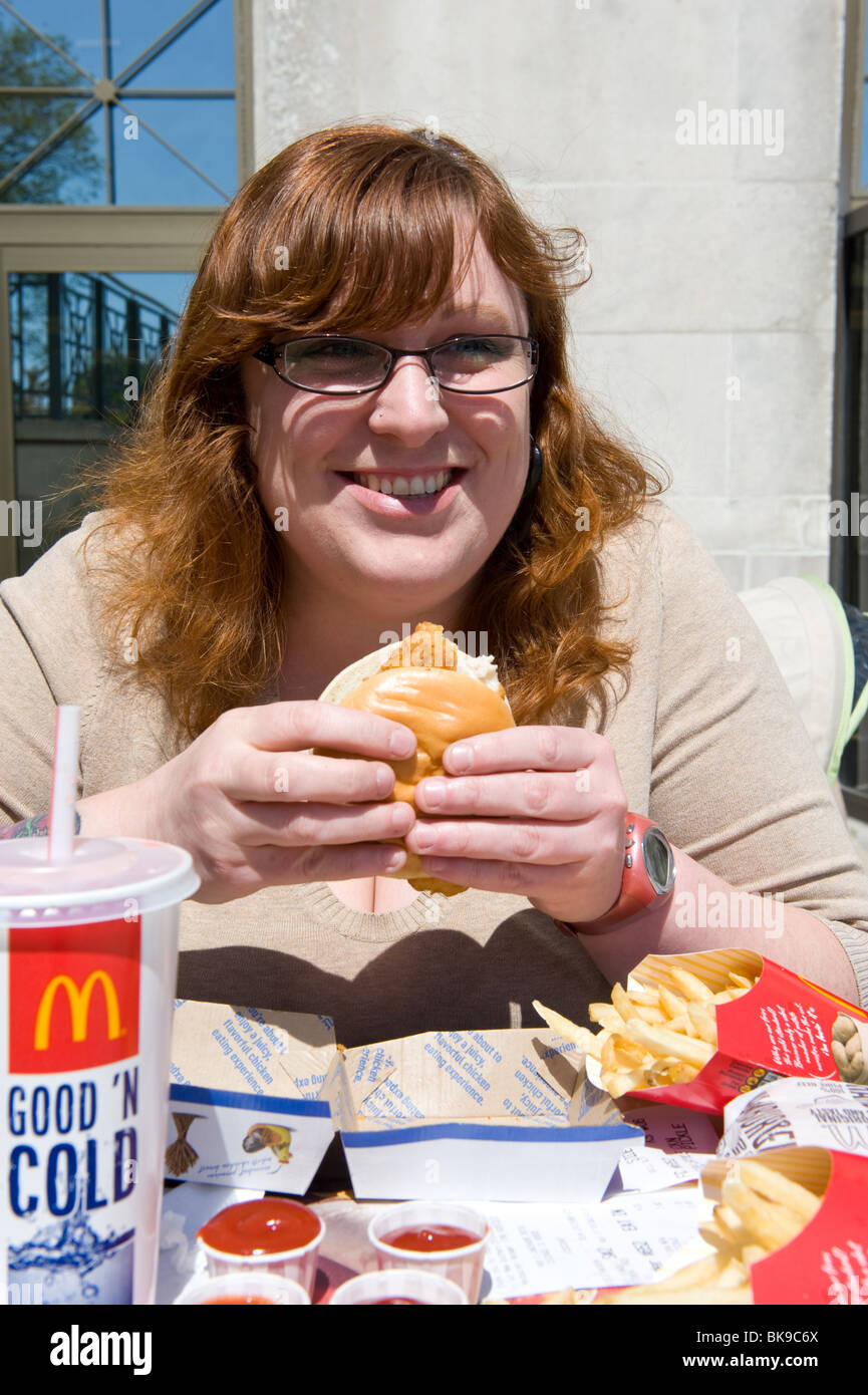 Overweight woman eating McDonald's fast food meal Stock Photo - Alamy