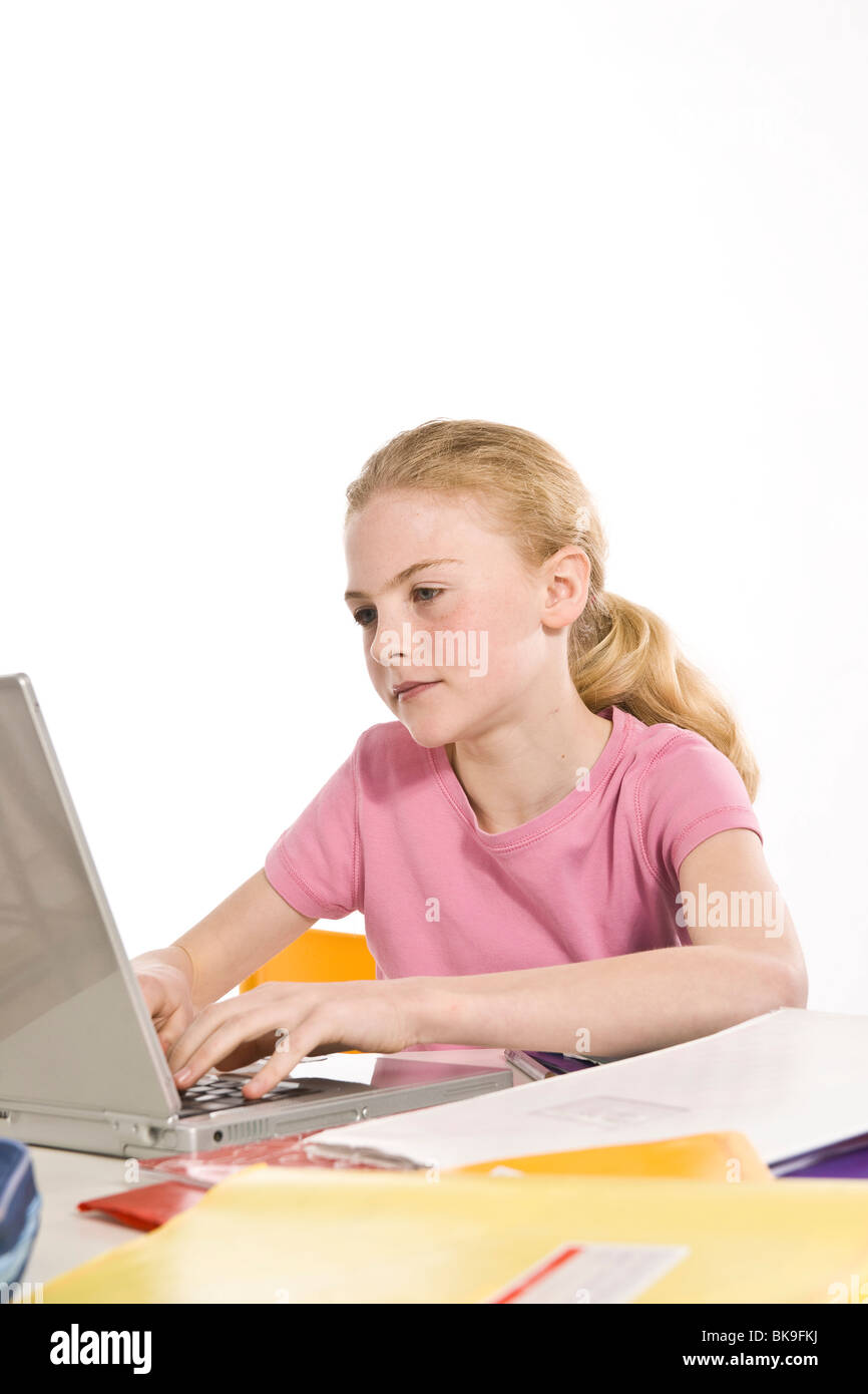 A girl doing her homework on a computer Stock Photo - Alamy
