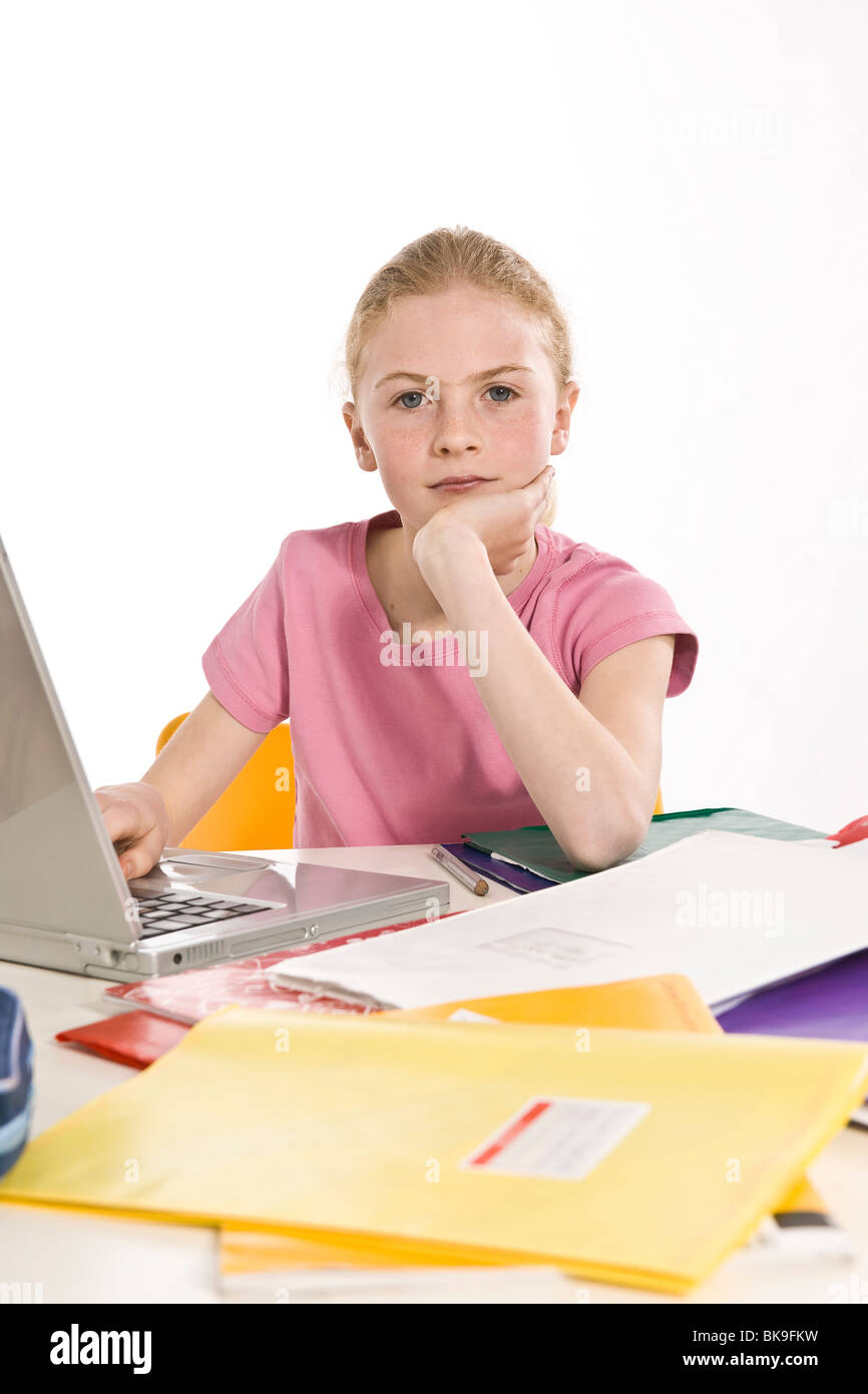 A girl doing her homework on a computer Stock Photo - Alamy