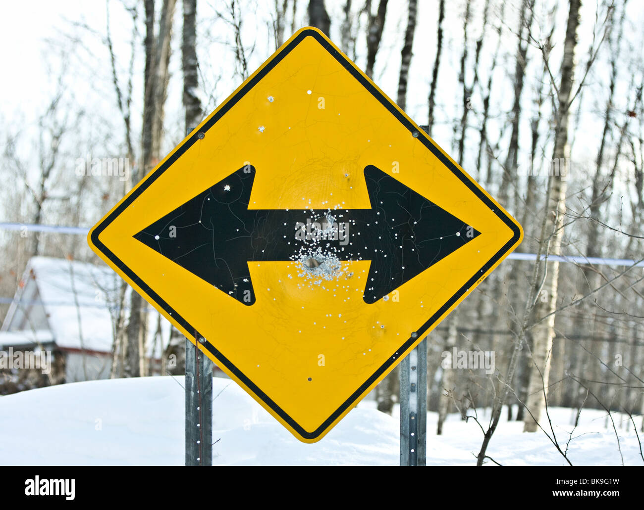Road sign with bullet impacts Stock Photo - Alamy