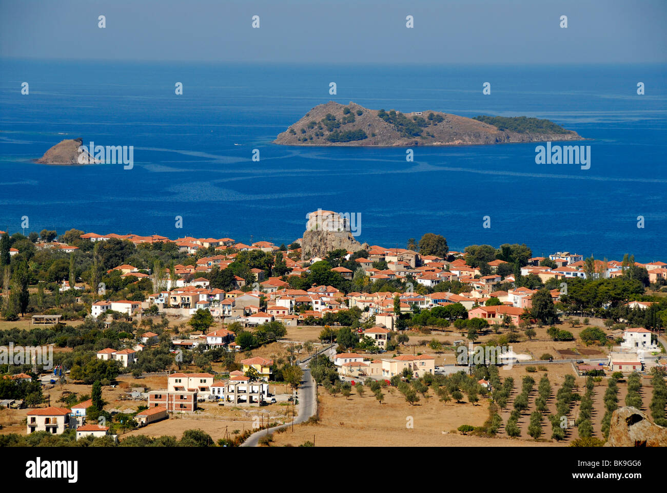 Seaside town with outlying islands, village built around a rock with a ...