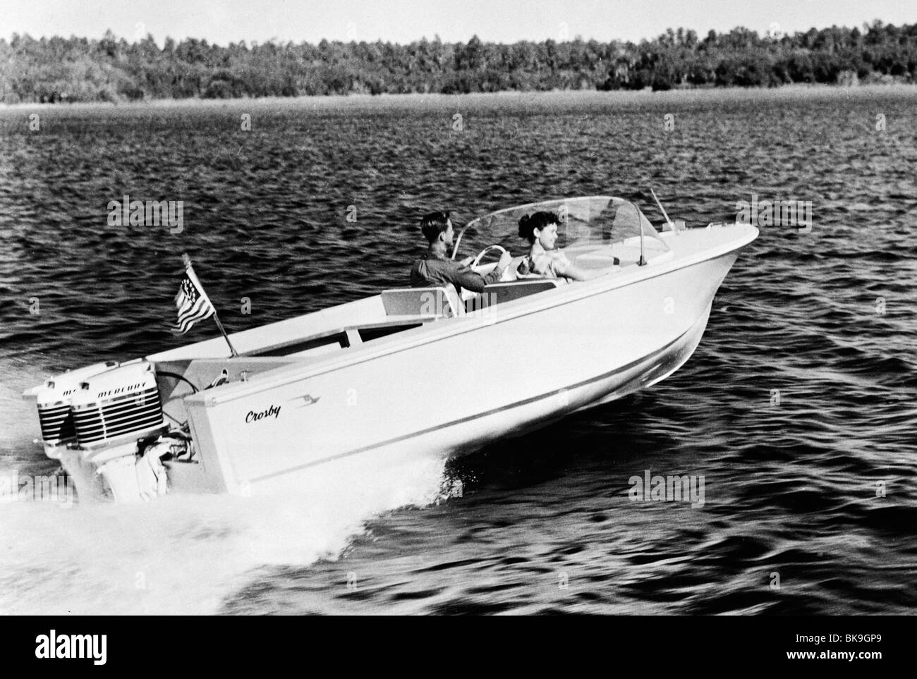 Young couple in speed boat Stock Photo - Alamy