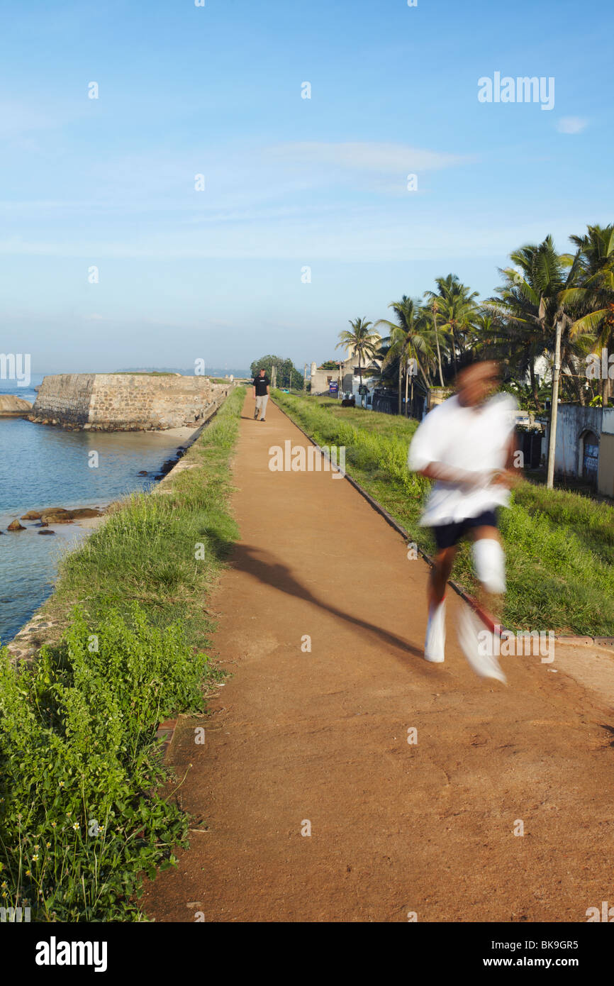 Man jogging on walls of Galle Fort, Galle, Sri Lanka Stock Photo - Alamy