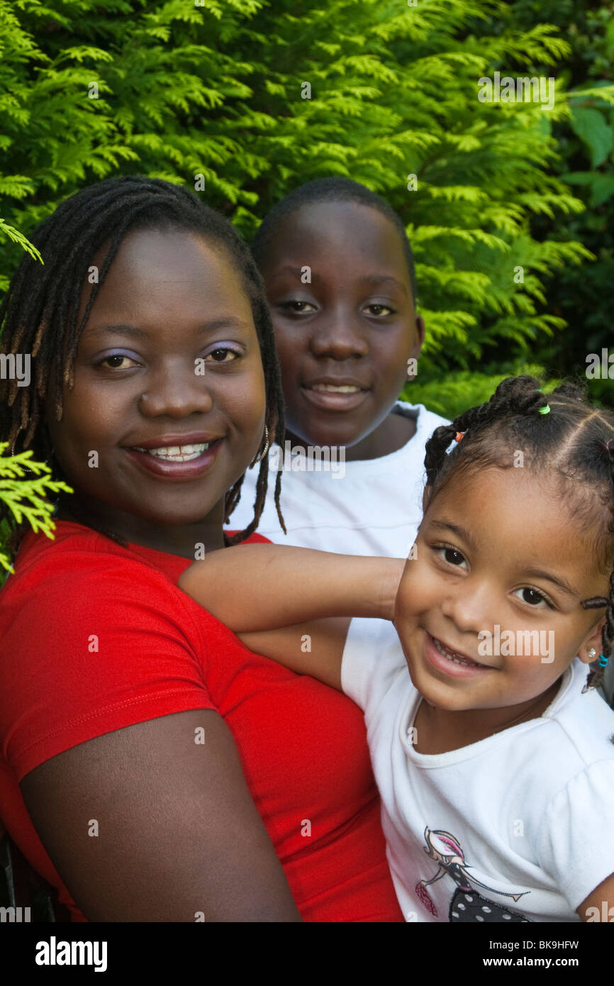 A happy relaxed family portrait in their garden Stock Photo - Alamy