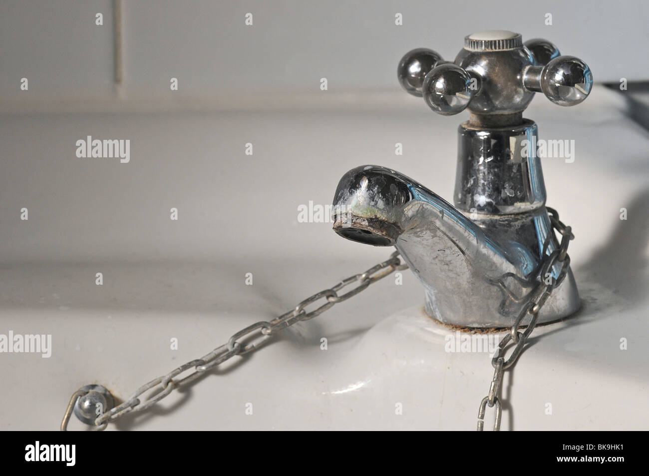 The right tap of a bathroom sink Stock Photo - Alamy