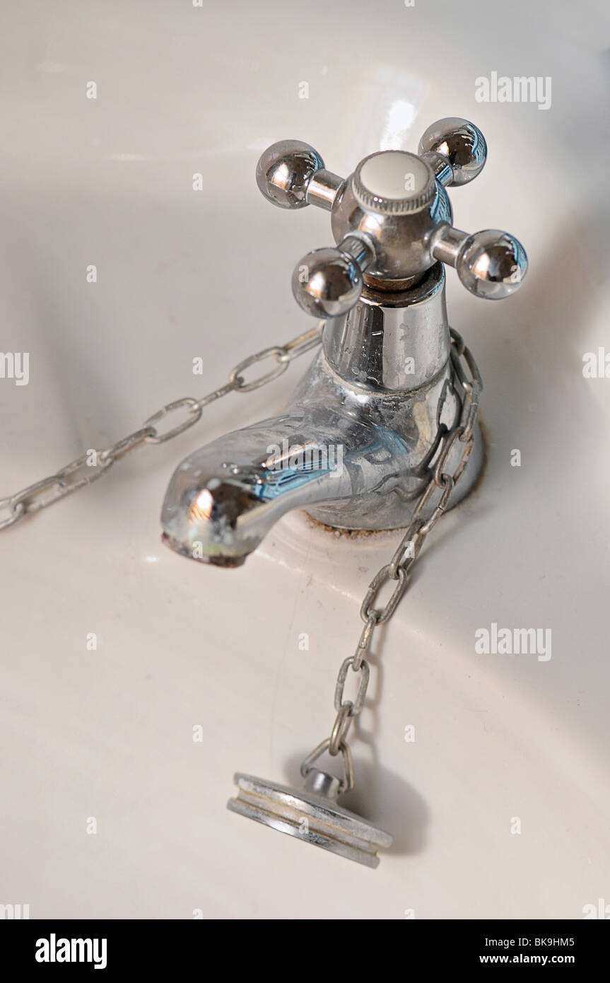 The right tap of a bathroom sink Stock Photo - Alamy