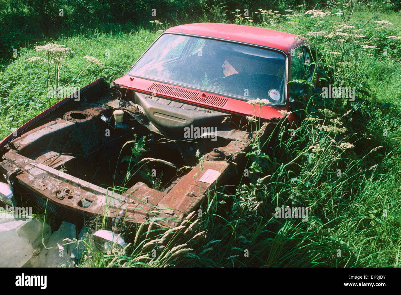Old car dumped in a field Stock Photo - Alamy