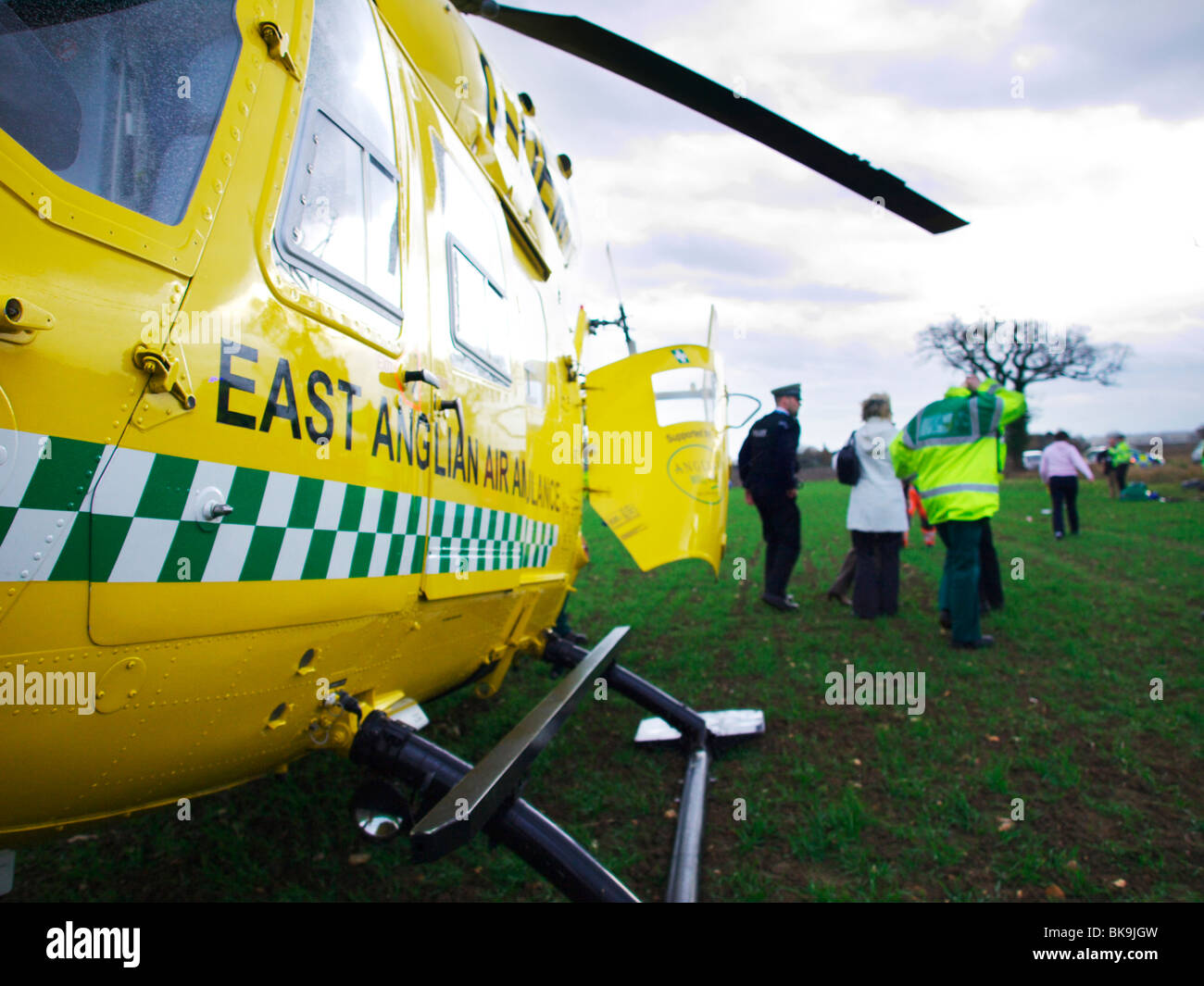 Air Ambulance lands in a field in Essex to treat patients from a road ...