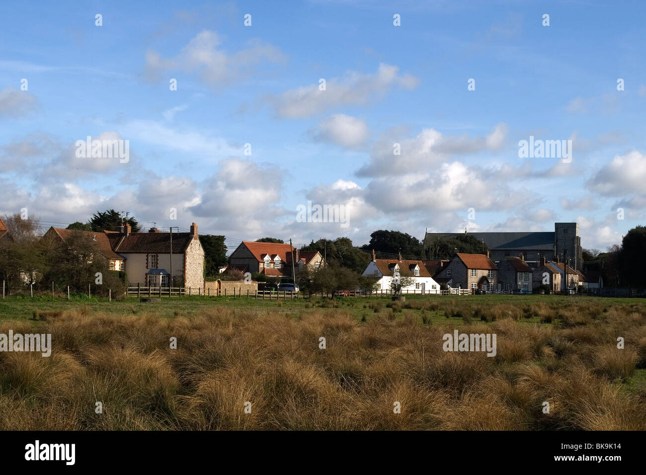 The village of Thornham in North Norfolk UK with All Saints Church seen ...