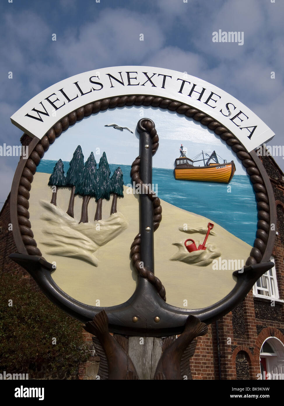 A painted sign for the town of Wells next the Sea Norfolk UK Stock ...