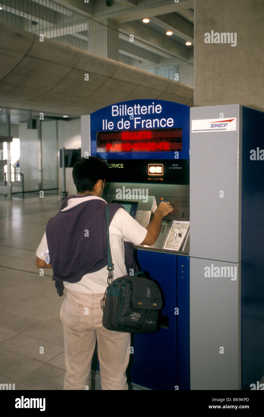 Frenchman, French man, buying train ticket, ticket machine, train ...