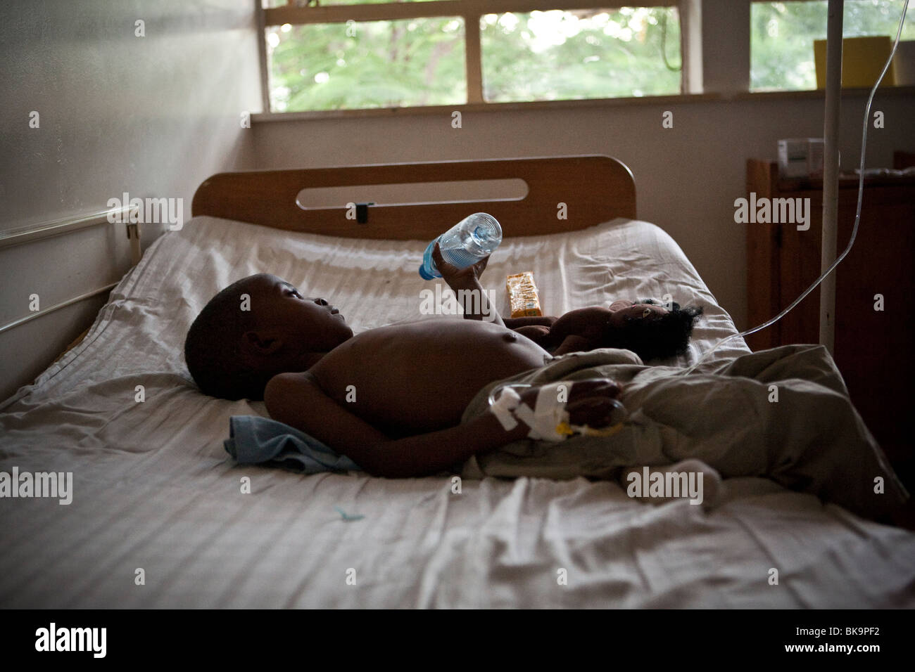 HIV positive child ill with malaria in hospital - Moshi, Tanzania Stock ...