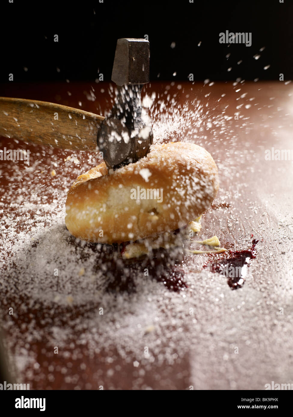 Doughnut being smashed by a hammer Stock Photo - Alamy