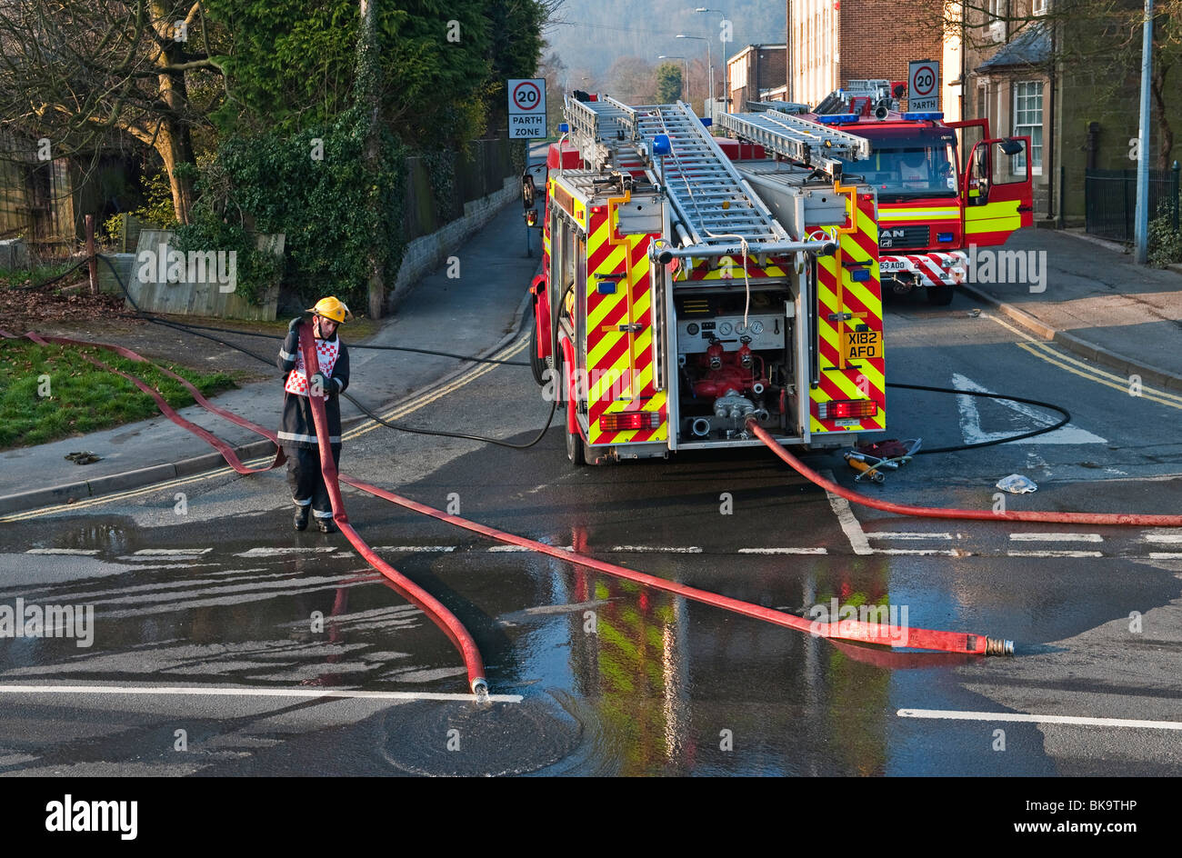 A fireman from the Mid-Wales Fire and Rescue Service at work clearing ...