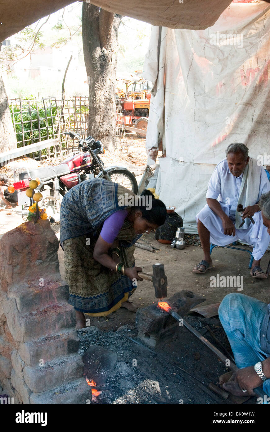 India, blacksmith home industry, forging iron Stock Photo - Alamy