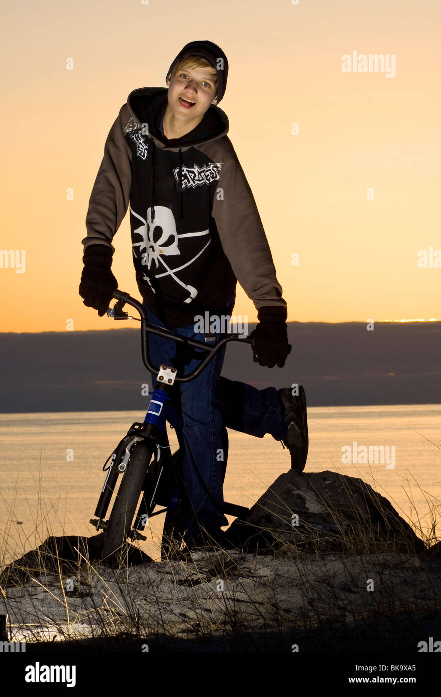 Boy riding bike, cycling in the night Stock Photo - Alamy