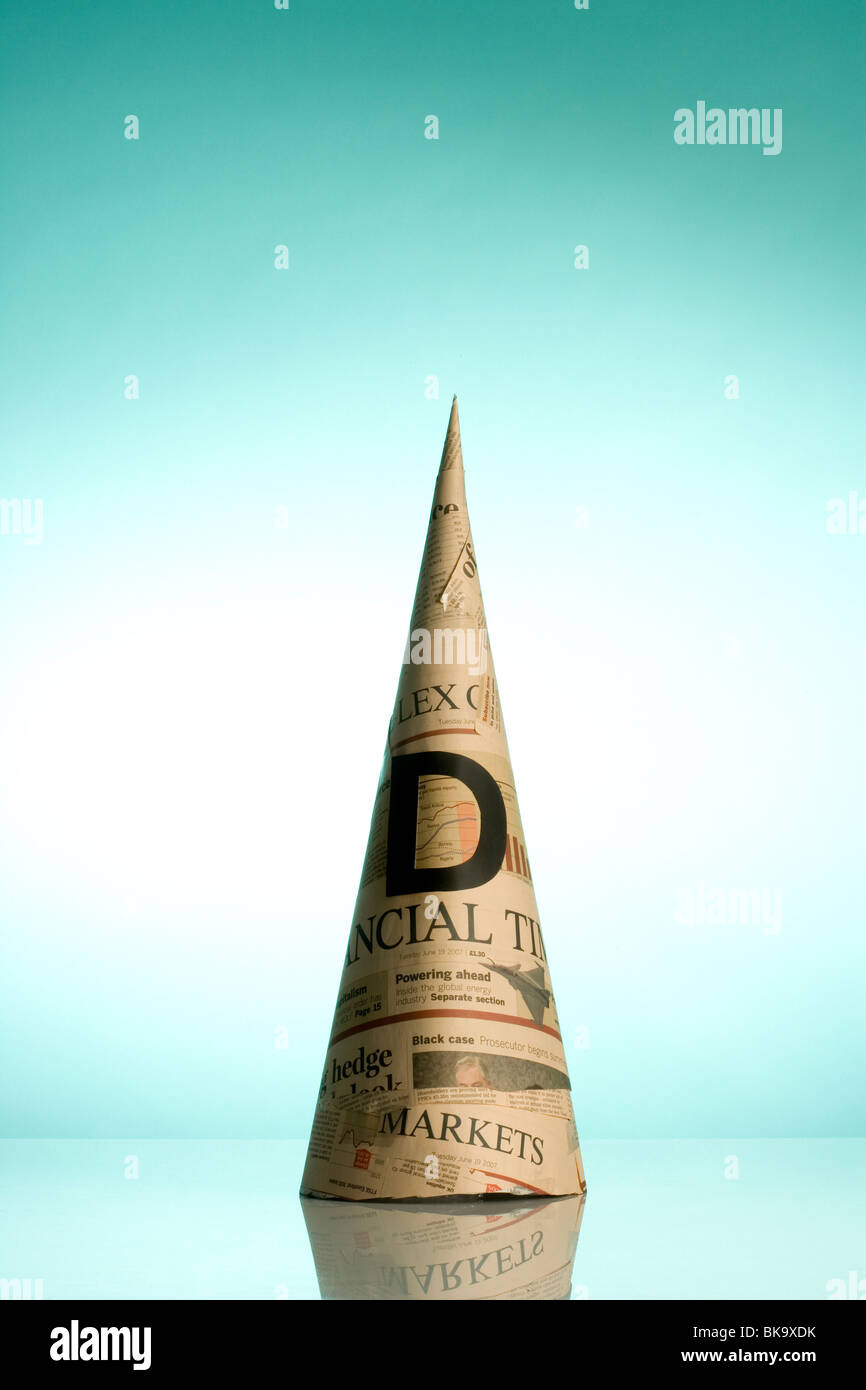 dunce's hat made from financial times Stock Photo - Alamy