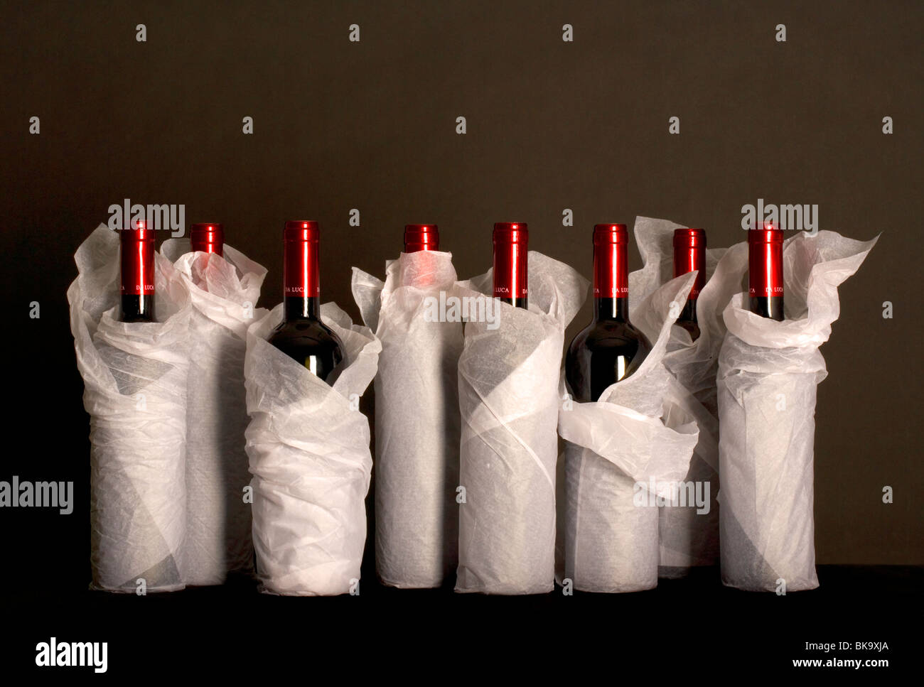 wrapped up wine bottles Stock Photo - Alamy