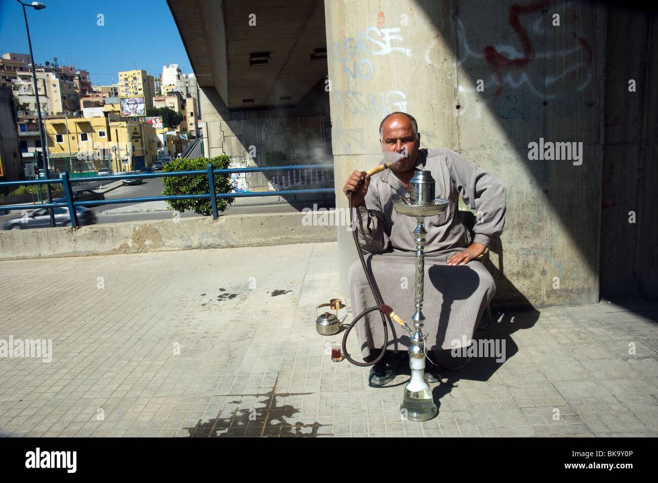 An Arab truck driver takes a rest at the edge of Beirut highway Lebanon ...