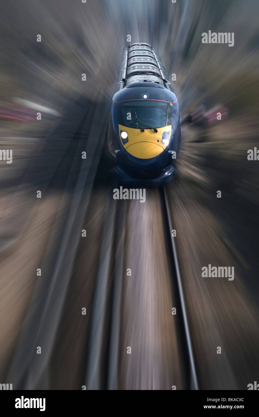 Highspeed train rush through the countryside Stock Photo - Alamy