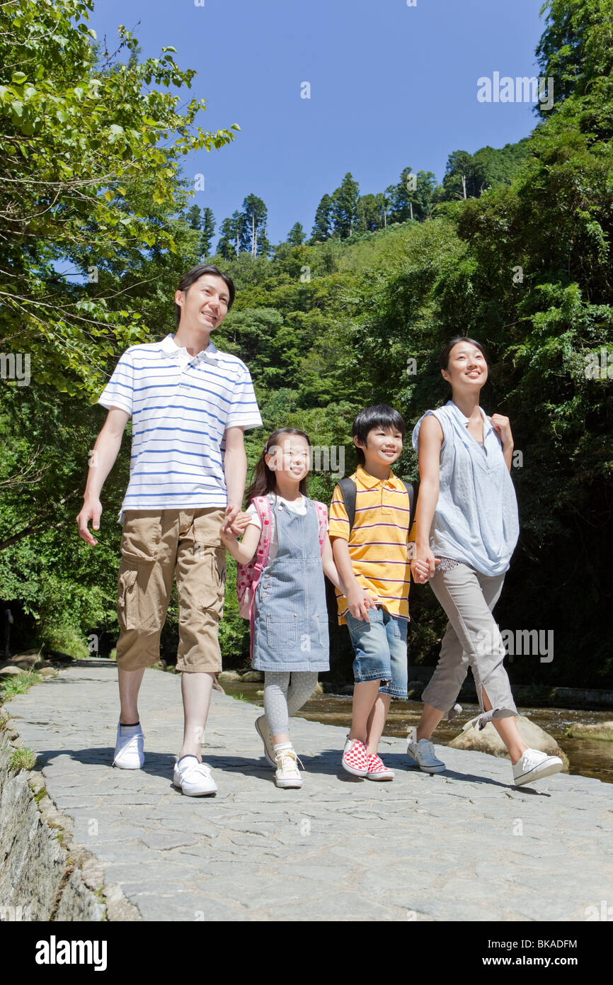 Family Crossing Bridge Stock Photo - Alamy