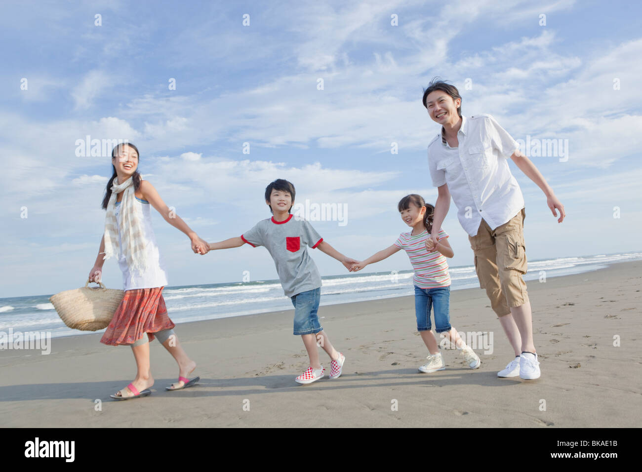 Family Walking Beach Stock Photo - Alamy