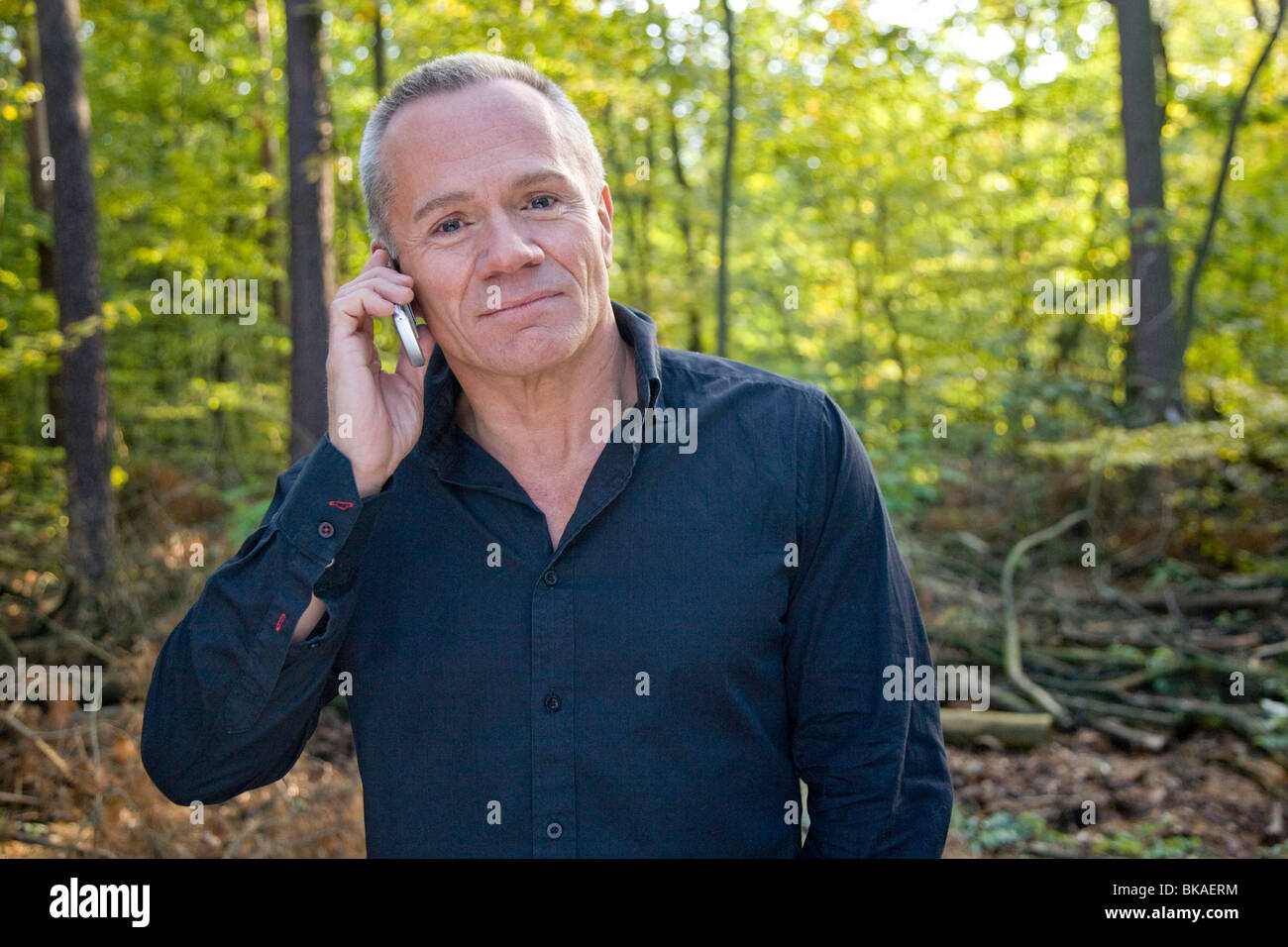 Old man walking in woods alone hi-res stock photography and images - Alamy