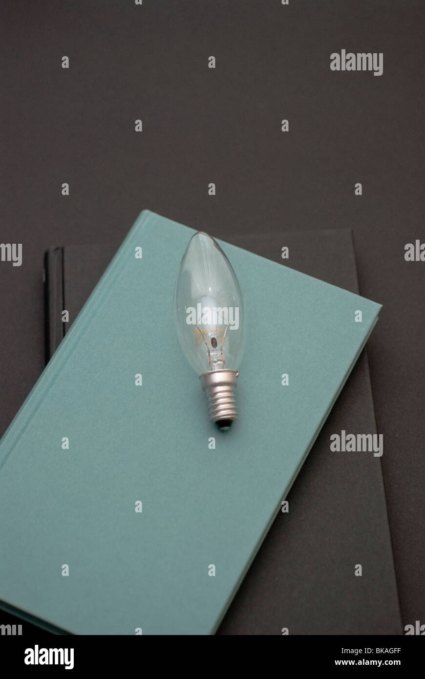 Bulb and books Stock Photo - Alamy