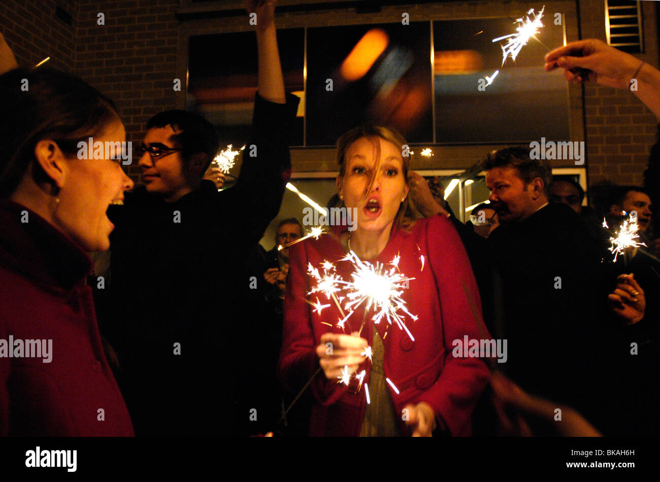 People celebrate with sparklers during a New Year's Eve wedding in ...