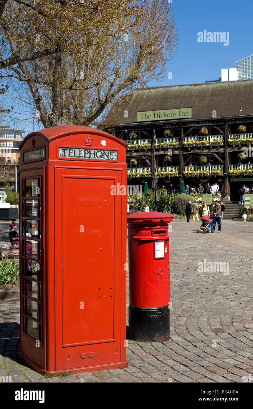 A traditional red telephone box and a letter box in the courtyard of ...