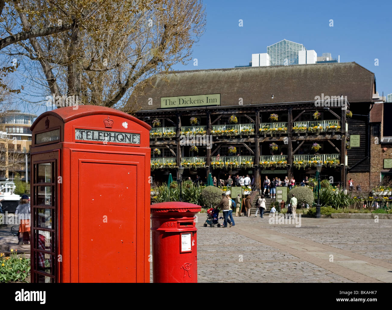 A traditional red telephone box and a cast iron red letter box near the ...