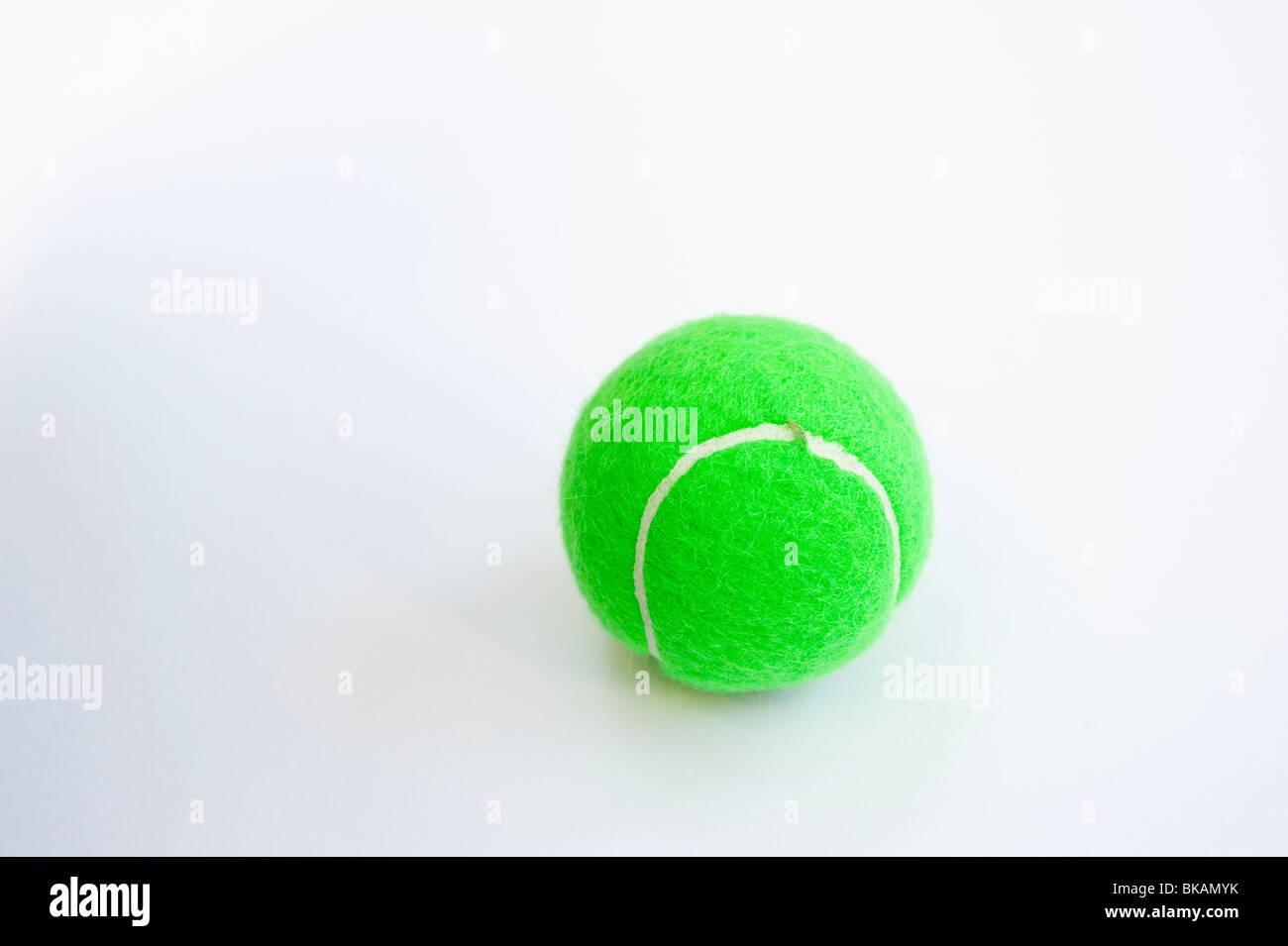 Green tennis ball used for children's tennis Stock Photo - Alamy