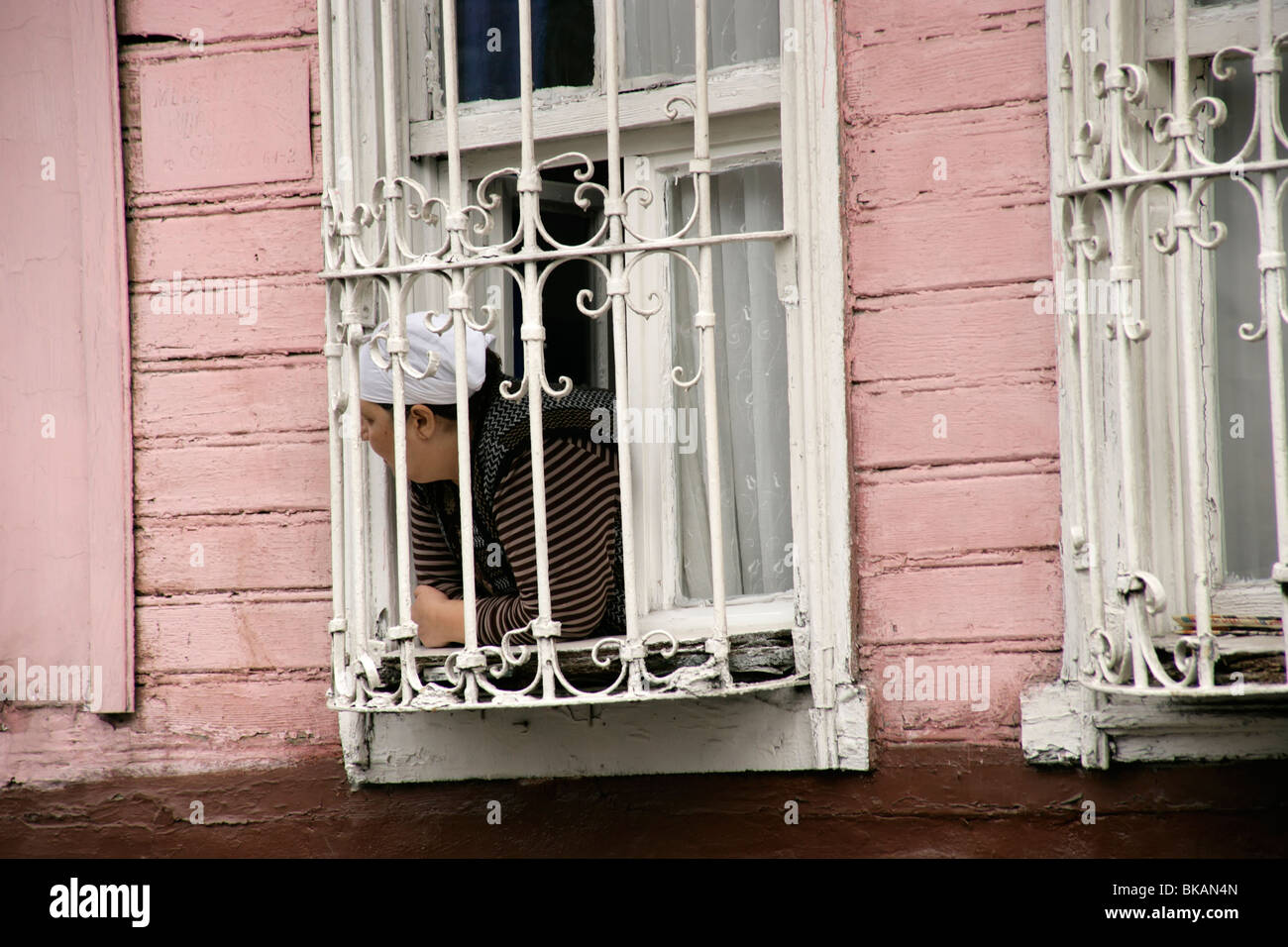 Woman leaning out of window in Ayvansaray, Istanbul, Turkey Stock Photo ...