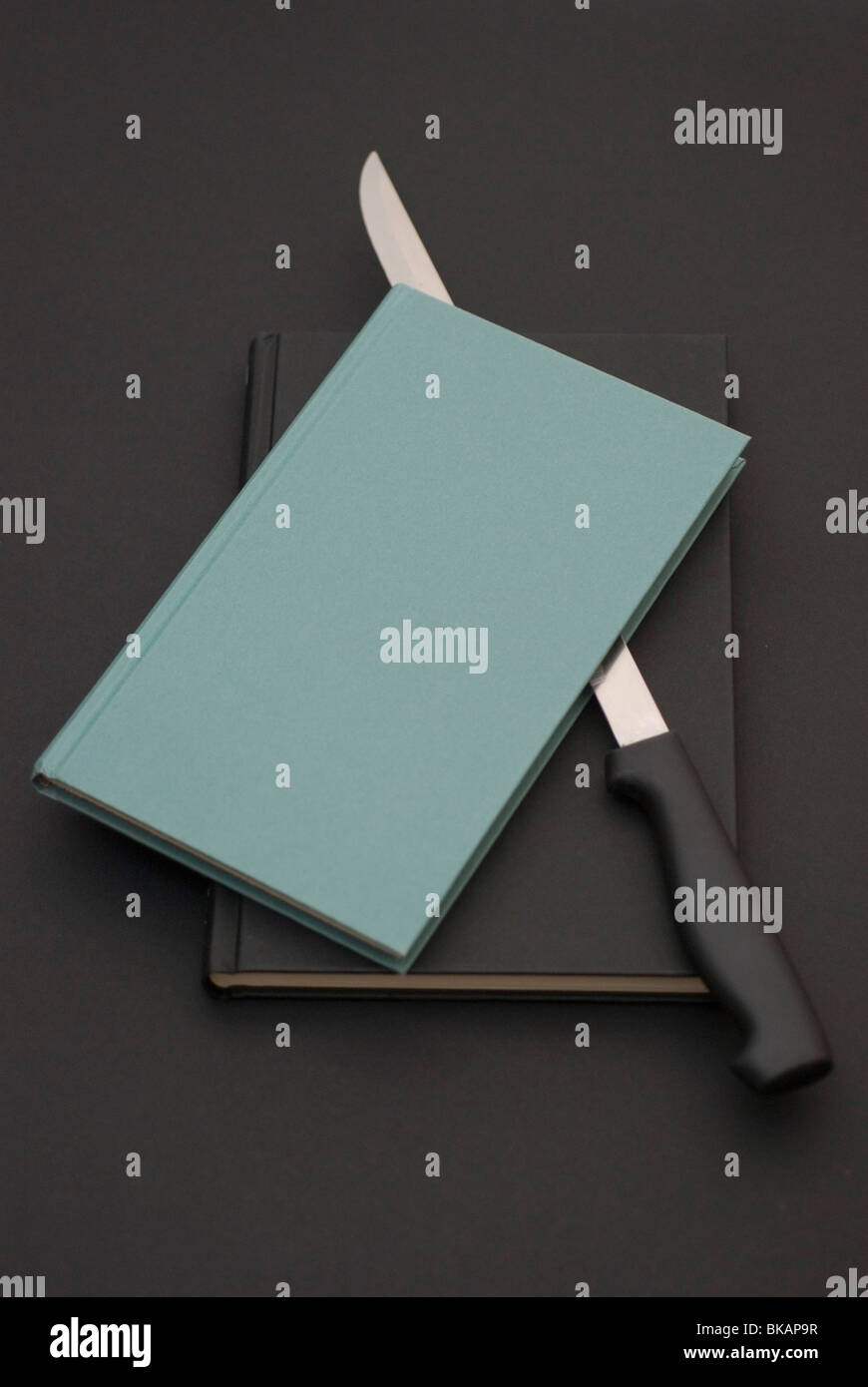knife cutting book Stock Photo - Alamy