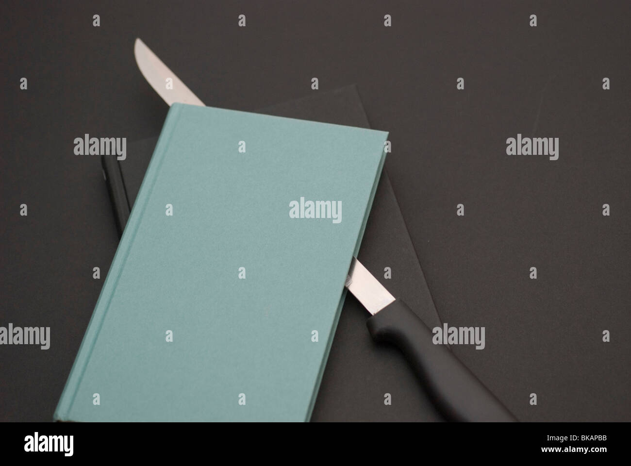 knife cutting book Stock Photo - Alamy