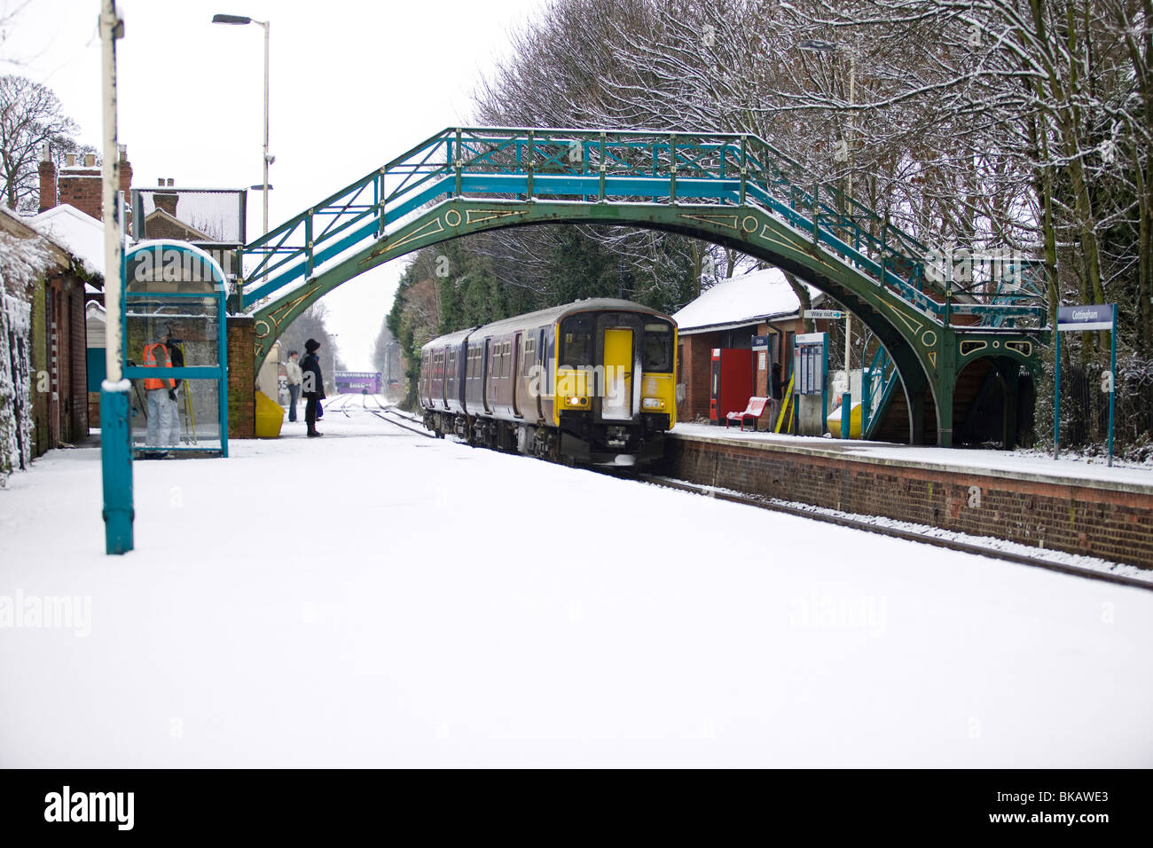train stopped at a station in thick winter snow Stock Photo - Alamy