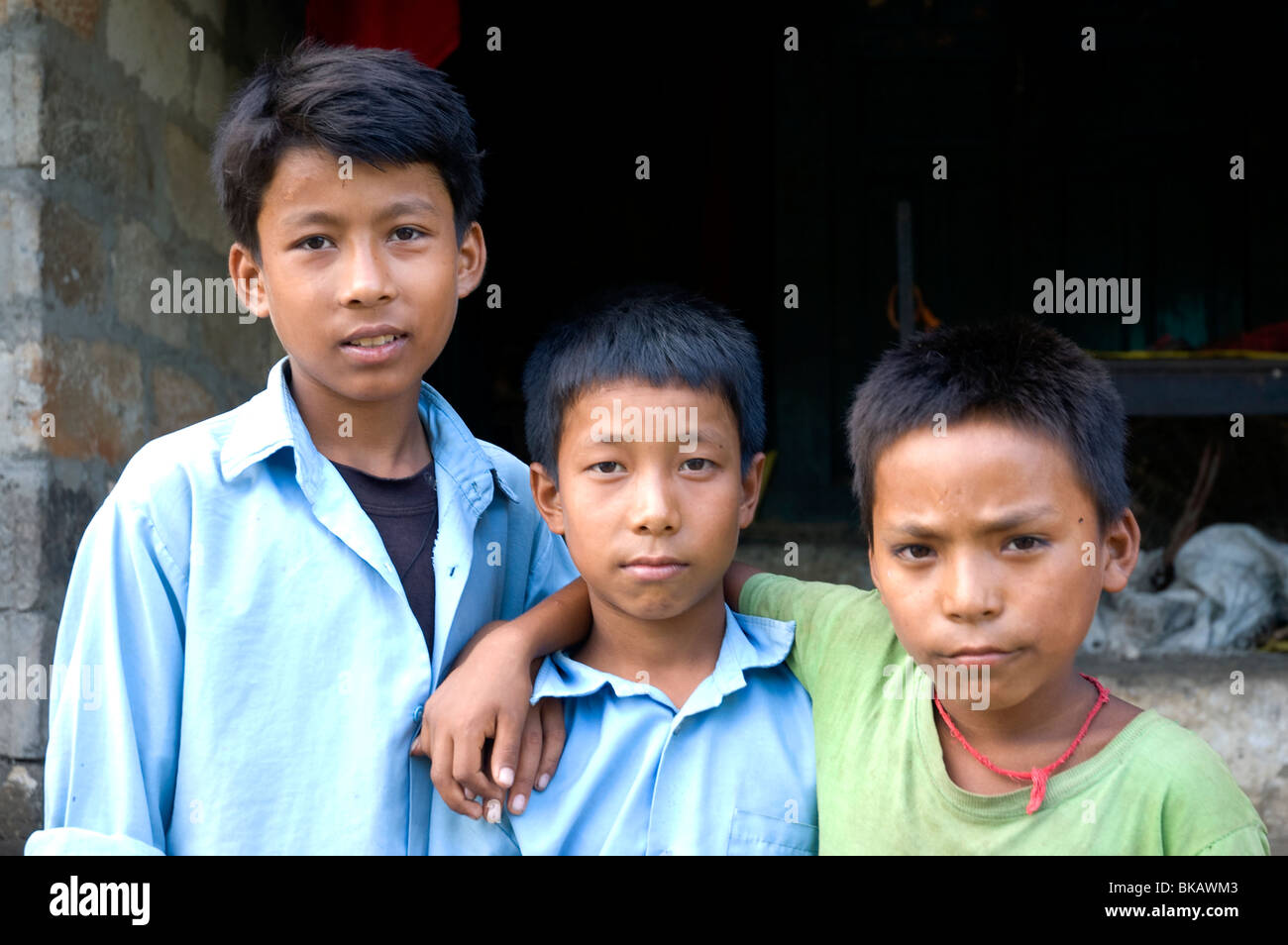 3 Nepali boys by the roadside in Nepal Stock Photo - Alamy