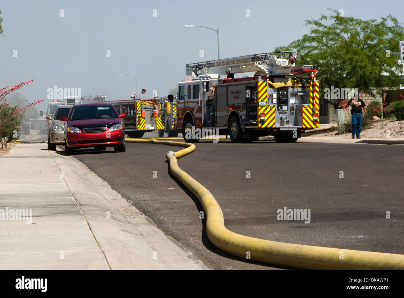 firefighters respond to a house fire in a residential area Stock Photo ...