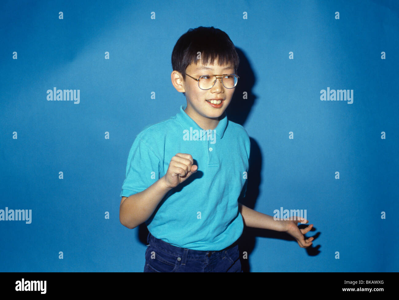 Korean Boy Miming Singing A Song Stock Photo - Alamy