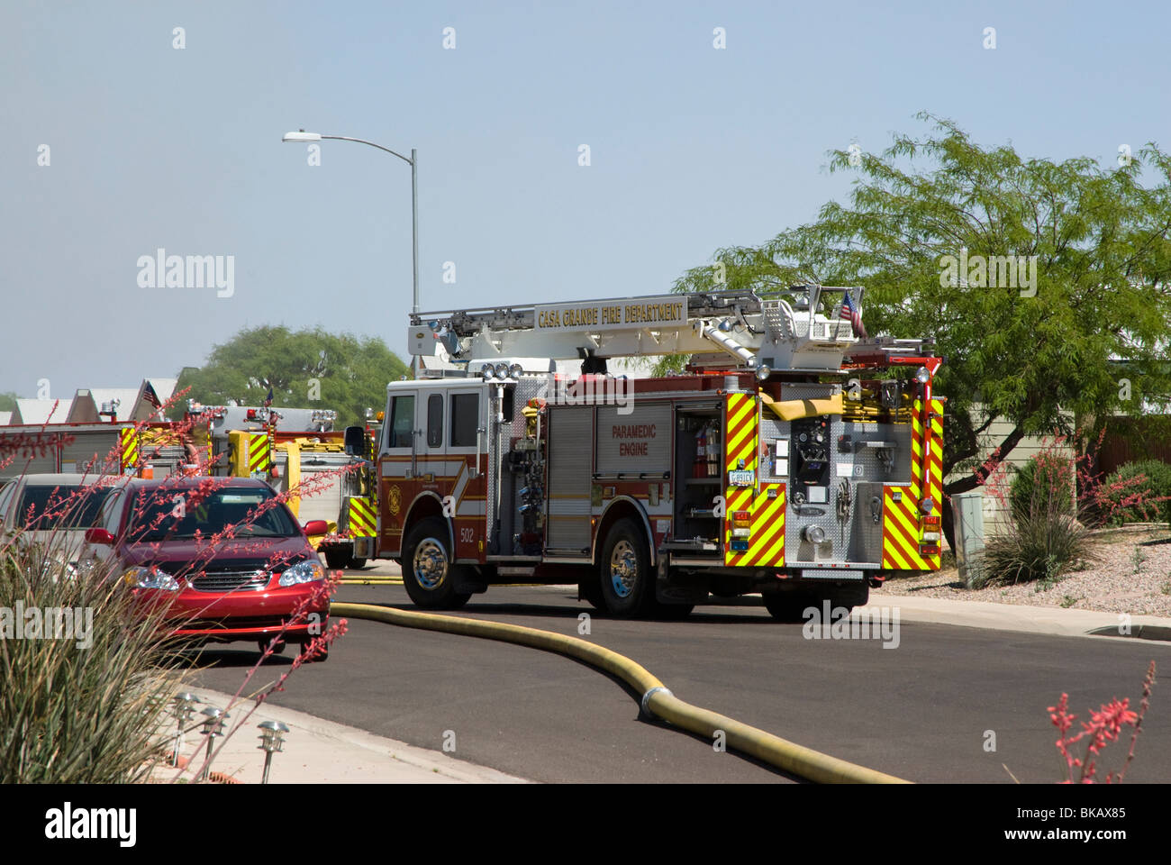 firefighters respond to a house fire in a residential area Stock Photo ...